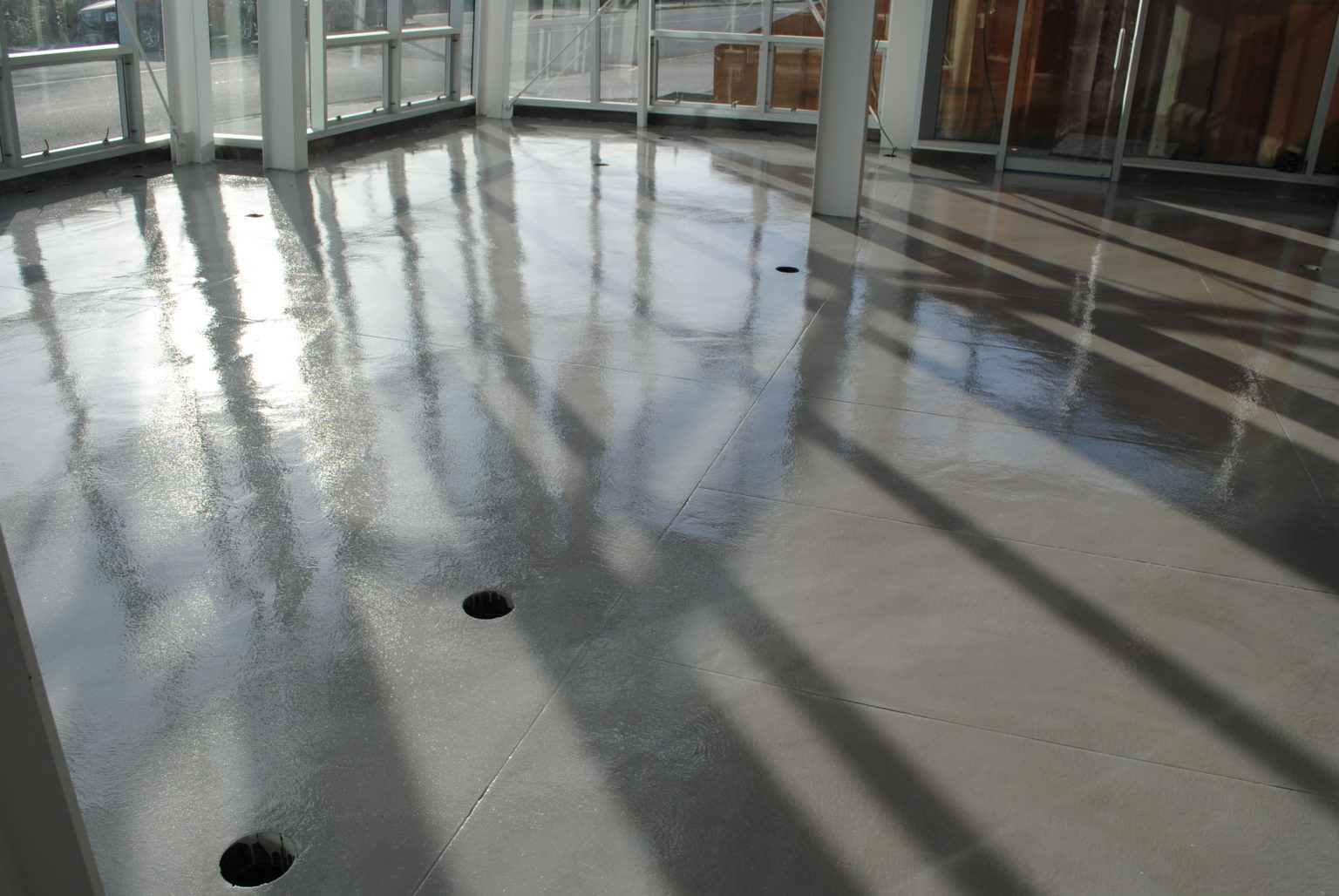 Using a Micro-topping to Repair Concrete Floors - Seattle Surfaces